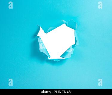 Blue torn paper whole with copyspace Stock Photo - Alamy