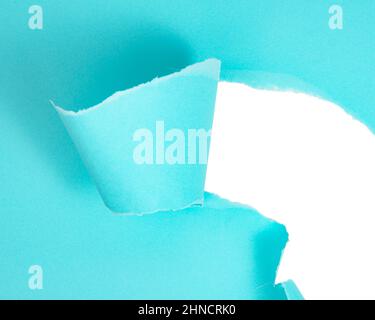 Blue torn paper whole with copyspace Stock Photo - Alamy