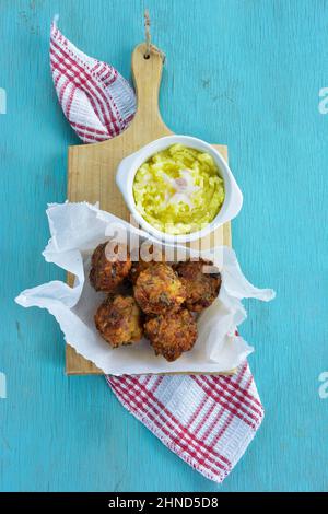 Croquettes of cod fish and garlic dip, known as skordalia and a black ...