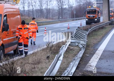 Damaged guard rail or guardrail between the pavement and road following ...