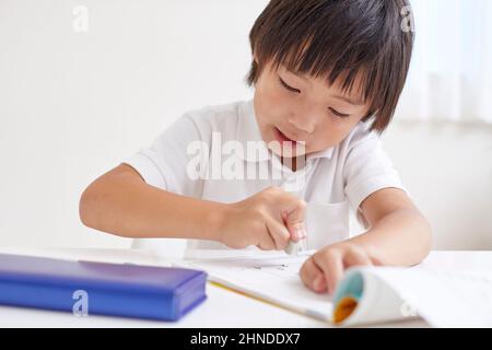 Japanese Elementary School Boy Doing His Homework Stock Photo - Alamy