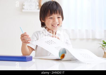 Japanese Elementary School Boy Doing His Homework Stock Photo - Alamy