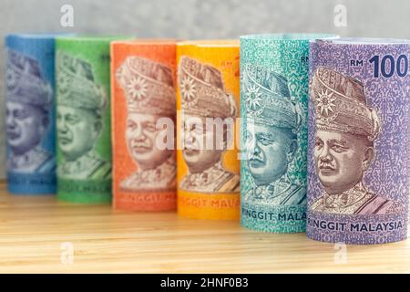 Malaysian currency, Money rolls, Ringgit banknotes lined up in a row ...