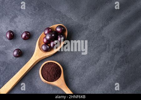 Euterpe oleracea - Acai berry powder in bowl Stock Photo - Alamy