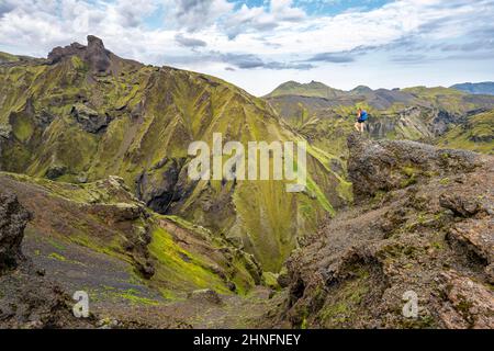 Hiker looks over spectacular landscape, Myrdalsjoekull glacier, Pakgil ...