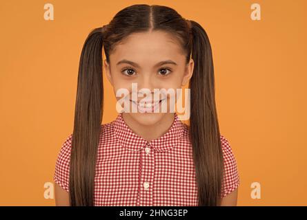 Bring inner beauty out. Happy girl portrait orange background. Child ...
