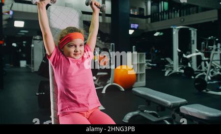 Fit Athletic Baby Girl Work out in Butterfly Pectoral Machine for Chest ...