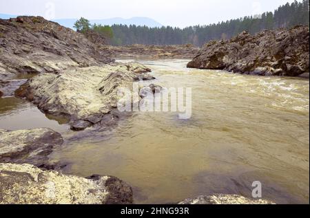 Manzherok rapids in the Altai Mountains. Stone island in the middle of ...