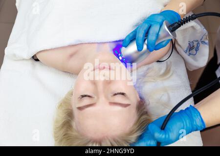 Chilled face cryotherapy in a spa salon. Care and rejuvenation of the ...