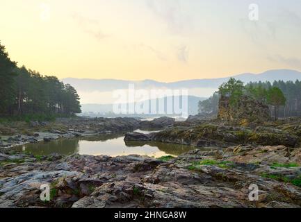 Manzherok rapids in the Altai Mountains. Stone island in the middle of ...