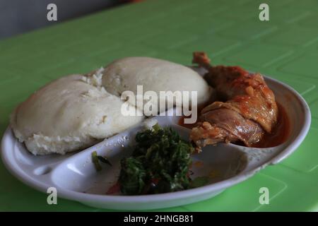 A plate of the staple food called 'nsima', thick porridge made of ...