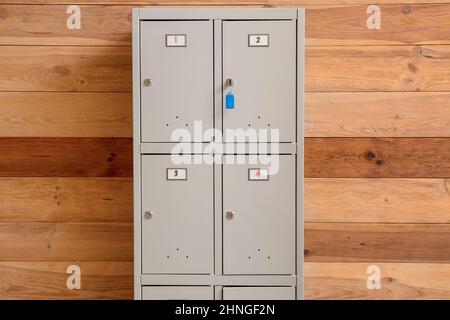 Modern locker near wooden wall Stock Photo - Alamy