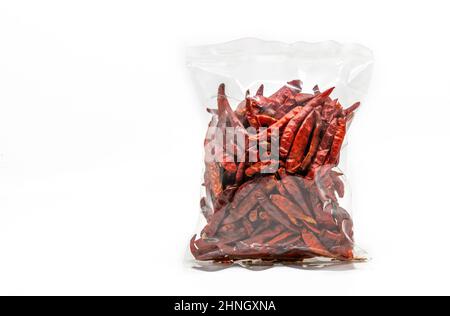 Red chilli in plastic bag on bamboo mat Stock Photo - Alamy
