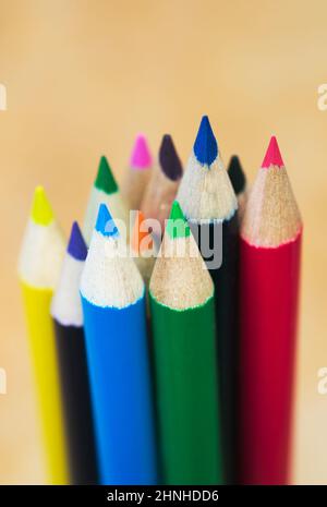 Close up of multi coloured pencils and school materials with copy space ...