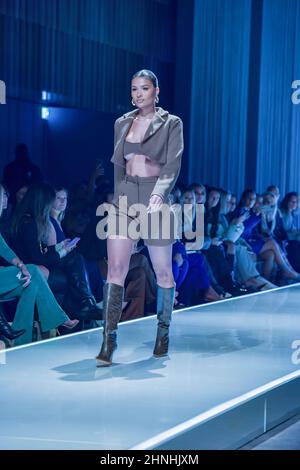 A model walks the runway at the PrettyLittleThing X Molly-Mae fashion ...