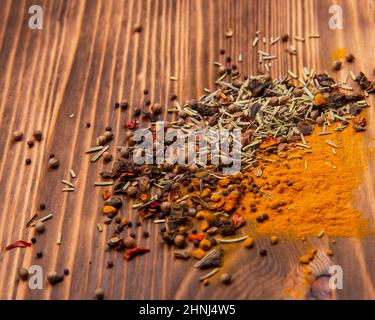 Dried different spices on wooden texture background Stock Photo - Alamy