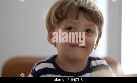 One child shakes head and hair being goofy and fun Stock Photo - Alamy