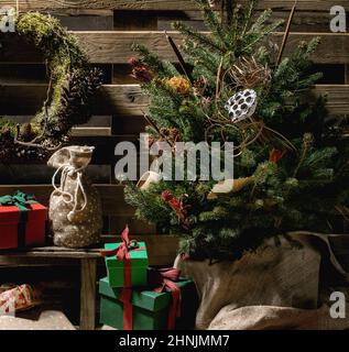 Christmas wreath and gift on wooden background Stock Photo - Alamy