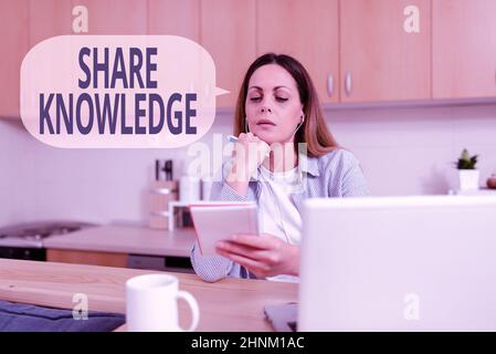 Hand writing sign Share Knowledge. Business approach activity through ...