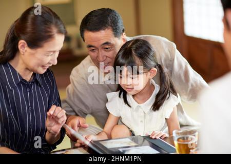 Smiling Three-Generations Japanese Family Stock Photo - Alamy