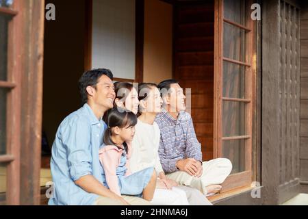 Three-Generations Japanese Family Sitting On The Porch Stock Photo - Alamy