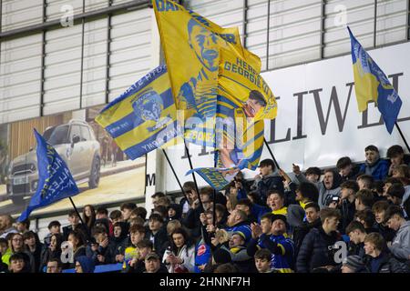 Warrington Wolves fans waving fans as the teams warm up Stock Photo - Alamy