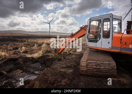 A digger on an Irish bog Stock Photo - Alamy