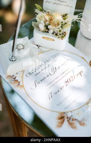 wedding rings with a wedding decor Stock Photo - Alamy