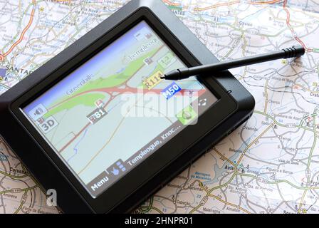 GPS global positioning device with stylus pen and map Stock Photo - Alamy