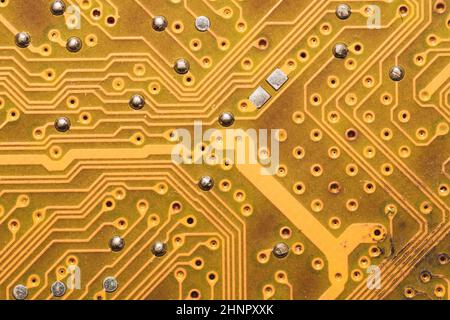 Close up burnt green microchip after short circuit due to water damage ...