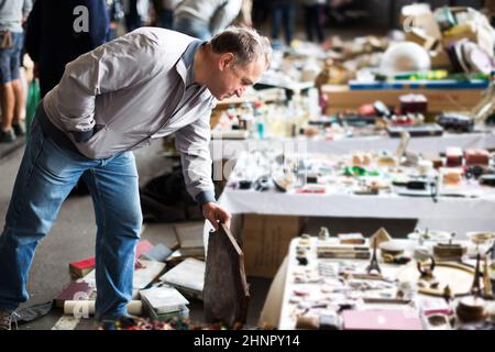 Male visiting old things market Stock Photo - Alamy