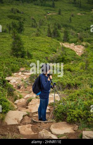 Girl Descend Down a Large Green Mountain Range Stock Photo - Alamy