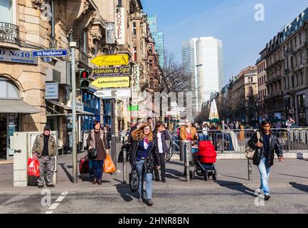 Pedestrians cross the street in front of the Chinese state-owned ...
