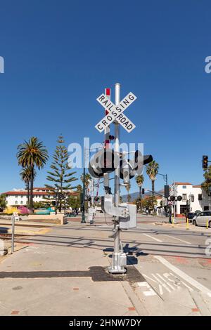 railroad crossing sign under clear blue sky Stock Photo - Alamy