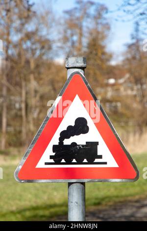 Level crossing with barrier or gate ahead road sign, isolated signpost ...