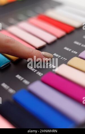 Woman choosing carpet, closeup Stock Photo - Alamy