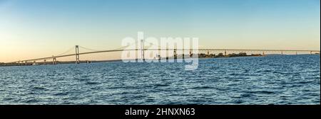view to famous Newport Bridge with lighthouse in sunset Stock Photo - Alamy