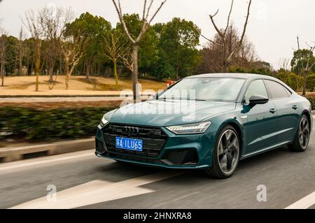 Audi A7L being driven on the road in Songjiang District, Shanghai ...