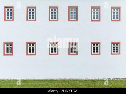 historic windows with red sandstone as harmonic background Stock Photo ...