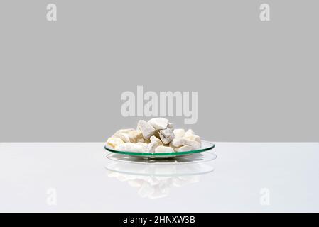 Calcium carbonate Chip in Chemical Watch Glass place next to crystal ...