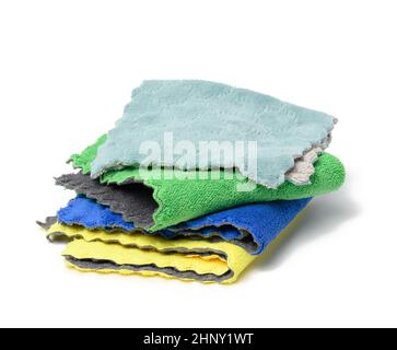 Stack of textile multicolored rags for cleaning on a white background ...