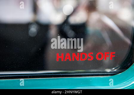 Lateral partial view of the side window of a vintage car with the ...