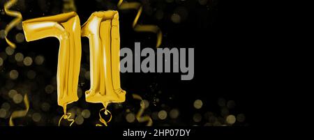 Gold foil balloon number number 71 on a background of blue velvet ...