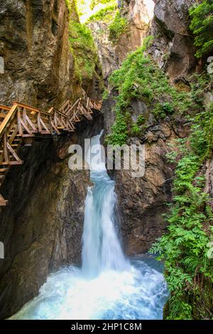 Walking through the Sigmund-Thun Klamm with wooden walkways near Kaprun ...