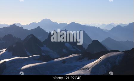 Mountain ranges in different shades of blue Stock Photo - Alamy