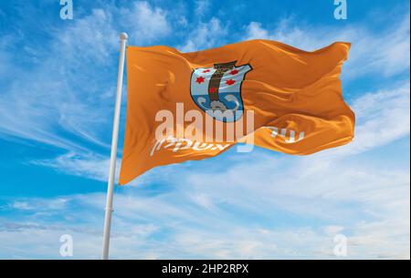 flag of Ashkelon , Israel at cloudy sky background on sunset, panoramic ...
