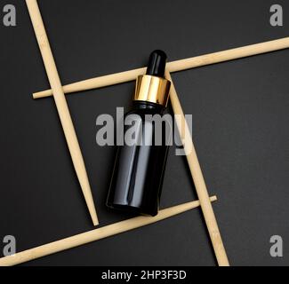 Brown glass bottle with pipette on a yellow background, top view Stock ...