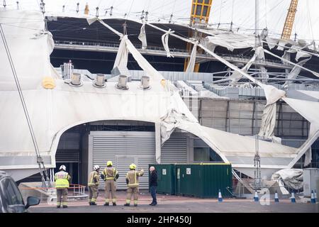 Firefighters inspect damage to the roof of the O2 Arena, in south east ...