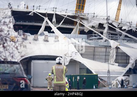 Firefighters inspect damage to the roof of the O2 Arena, in south east ...