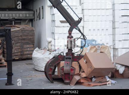 garbage truck with manual hydraulic. Claws of mechanical moving arm ...